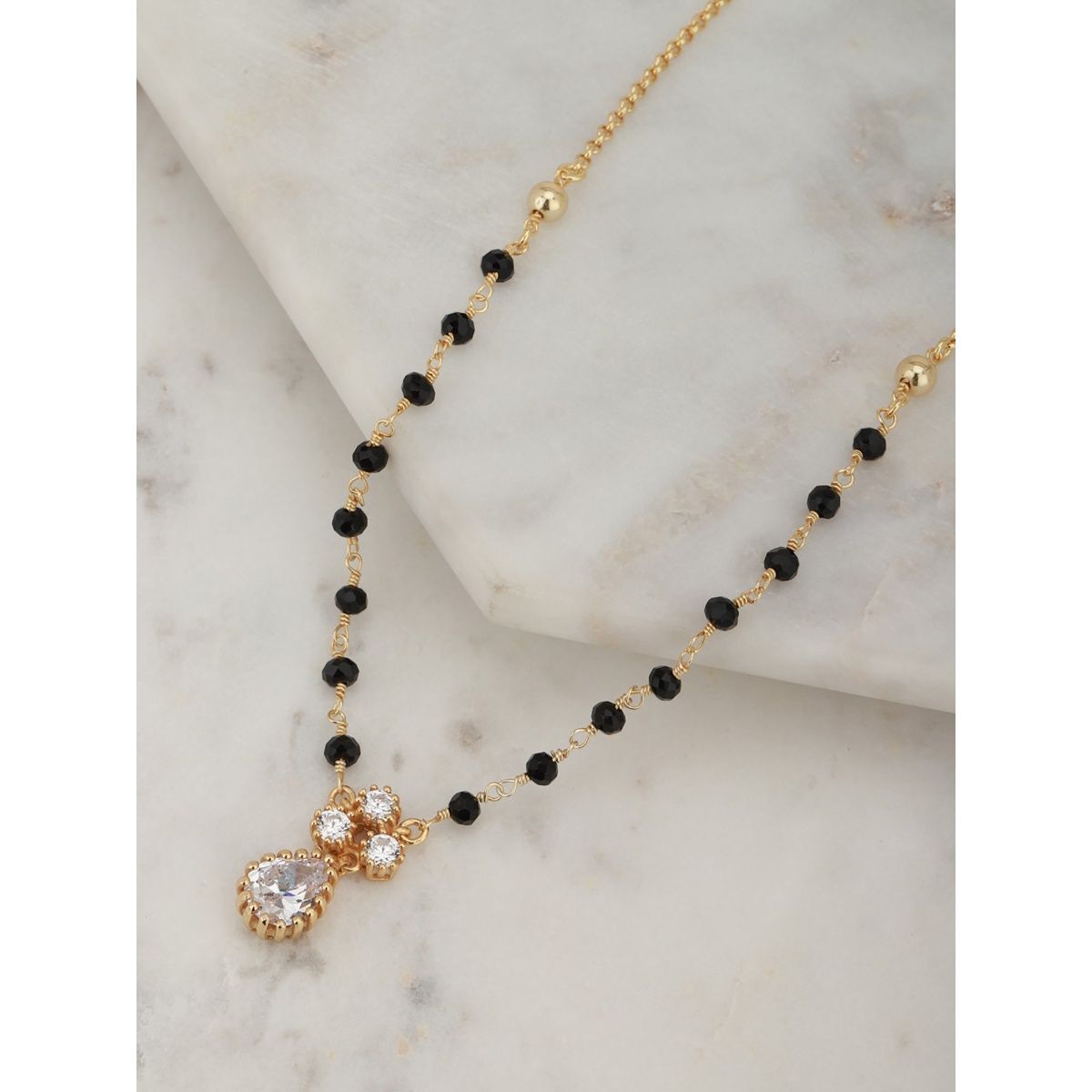 Buy Carlton London Black Gold Plated Cz Studded and Beaded Tear Drop Shaped Mangal Sutra Online