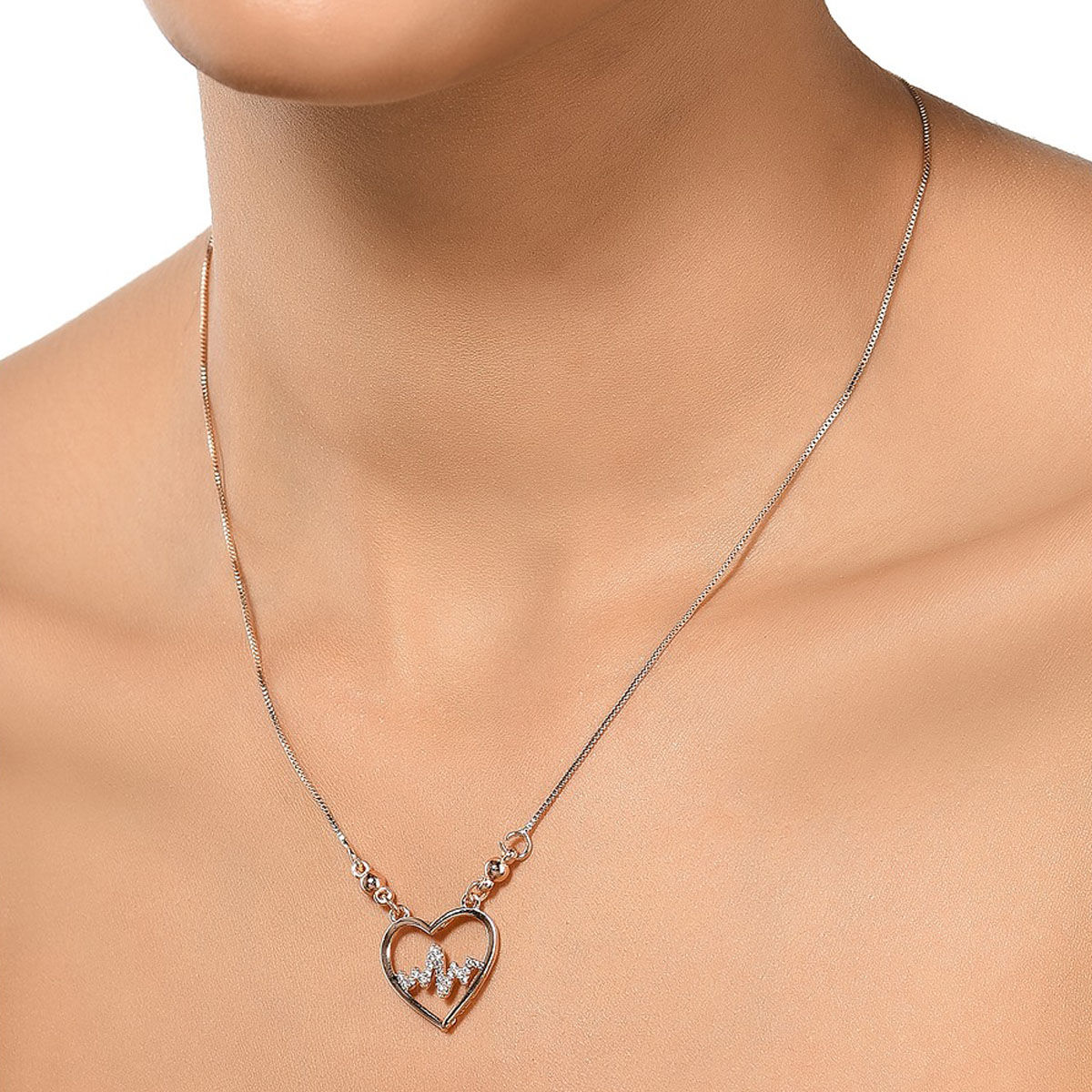 Buy Zaveri Pearls Rose Gold Cubic Zirconia Heartbeat & Heart Pendant ...