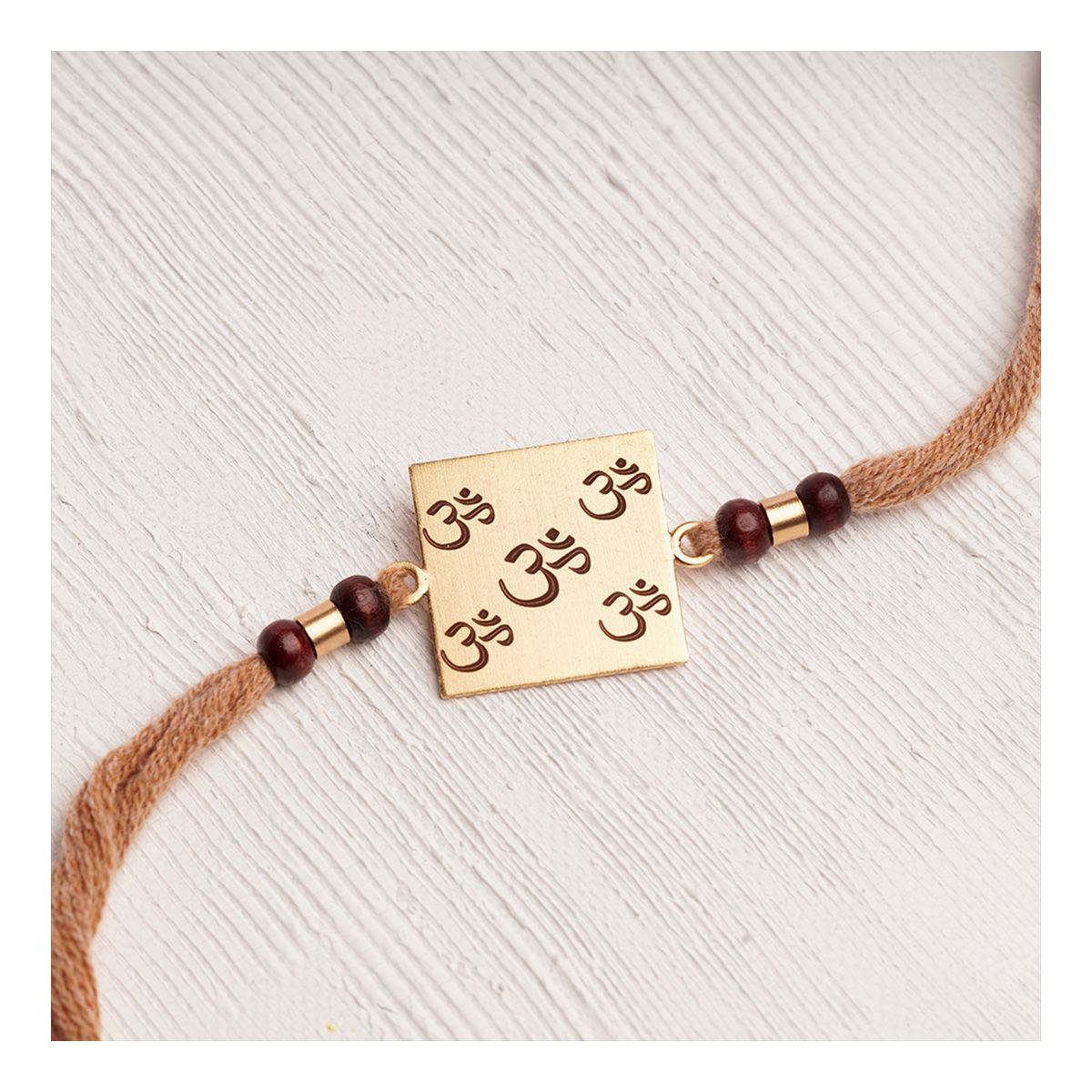 Buy Suhani Pittie Square Laser Om Rakhi with Chandan Beads (22k Gold ...