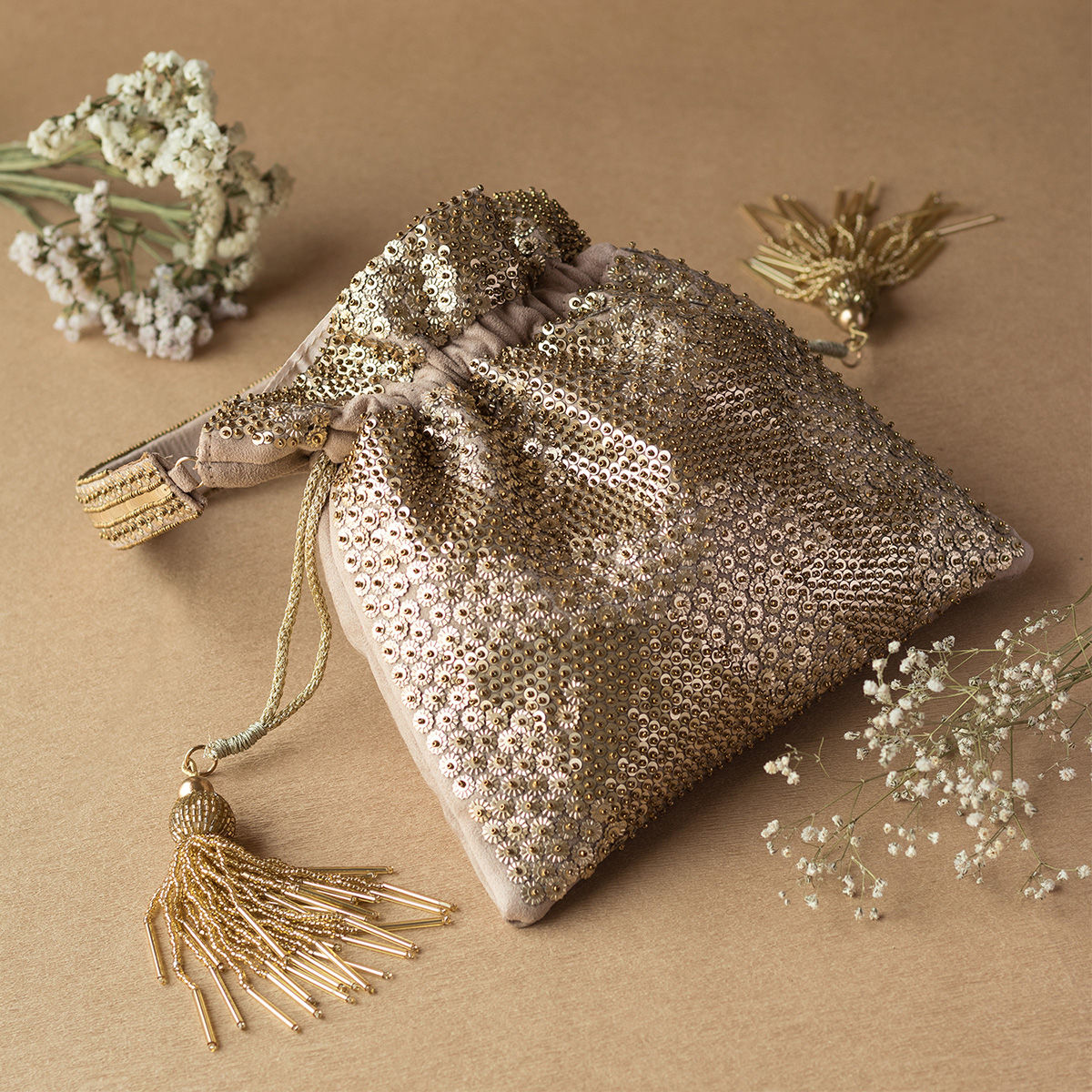 Buy Angeline Beige Golden Potli Bag Online