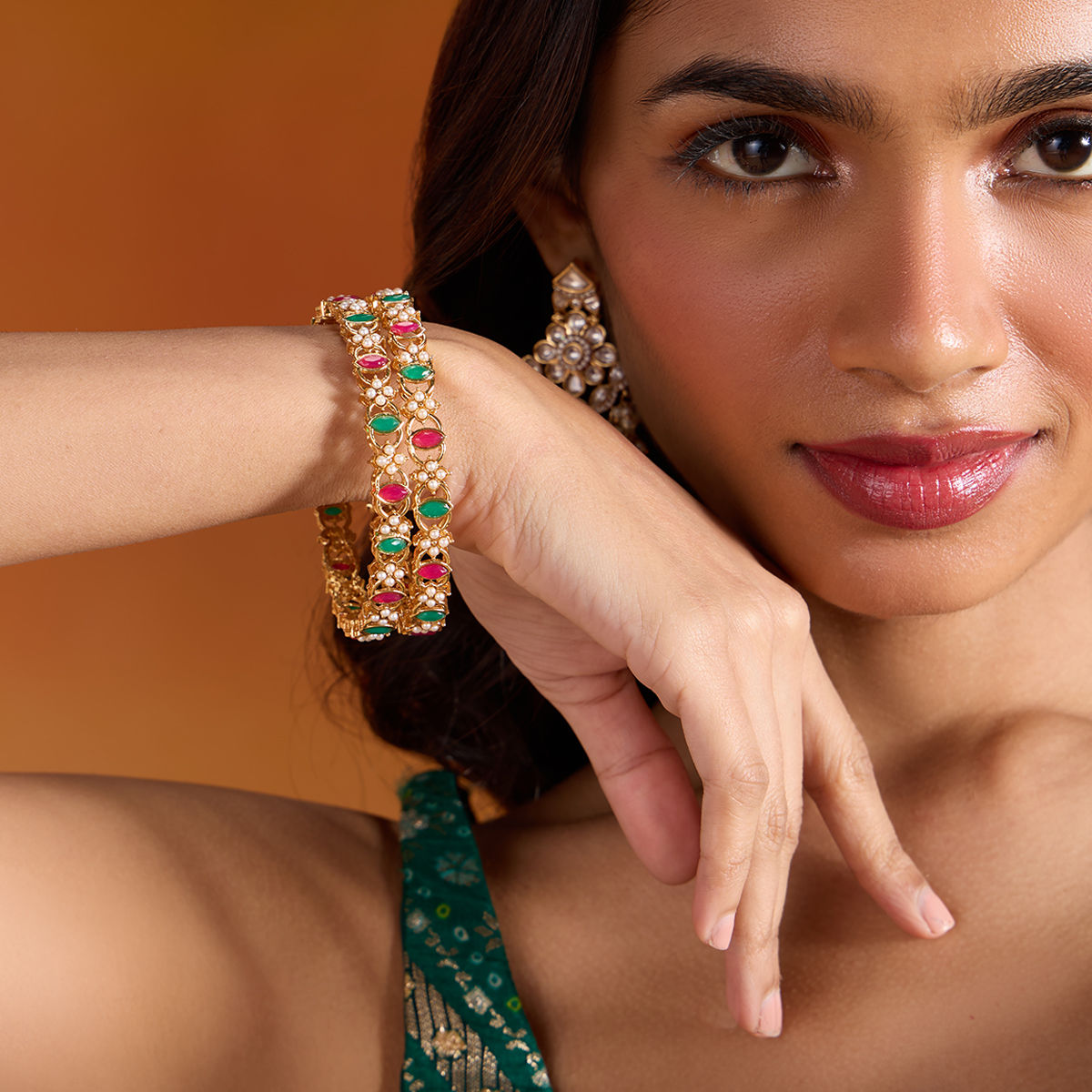Buy Azai by Nykaa Fashion Set of 2 Gold Red and Green Stone Studded Pearl Bangles Online