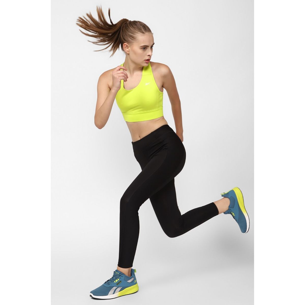 Reebok Women Yellow Solid Sports Bra: Buy Reebok Women Yellow Solid ...