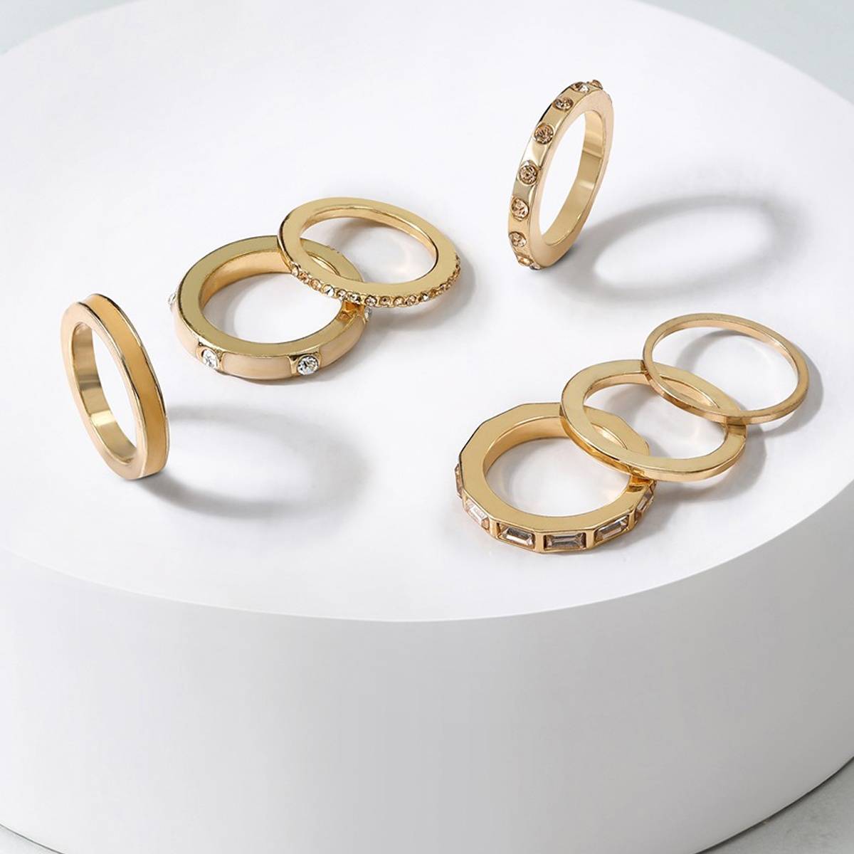 Buy Zaveri Pearls Gold Tone Set of 7 Stunning Stackable Finger Rings ...