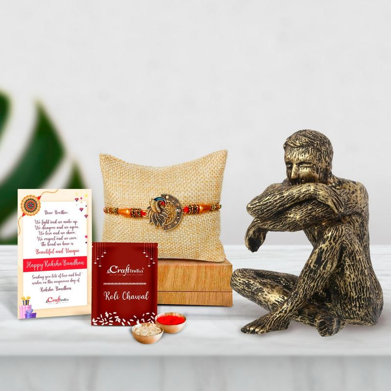 Buy eCraftIndia Designer Peacock Rakhi with Man Sitting In Thinking ...
