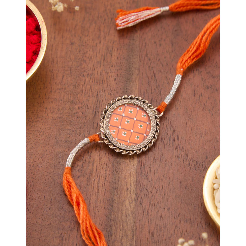 Buy Fabindia Orange Thread Rakhi with Roli Chawal Online