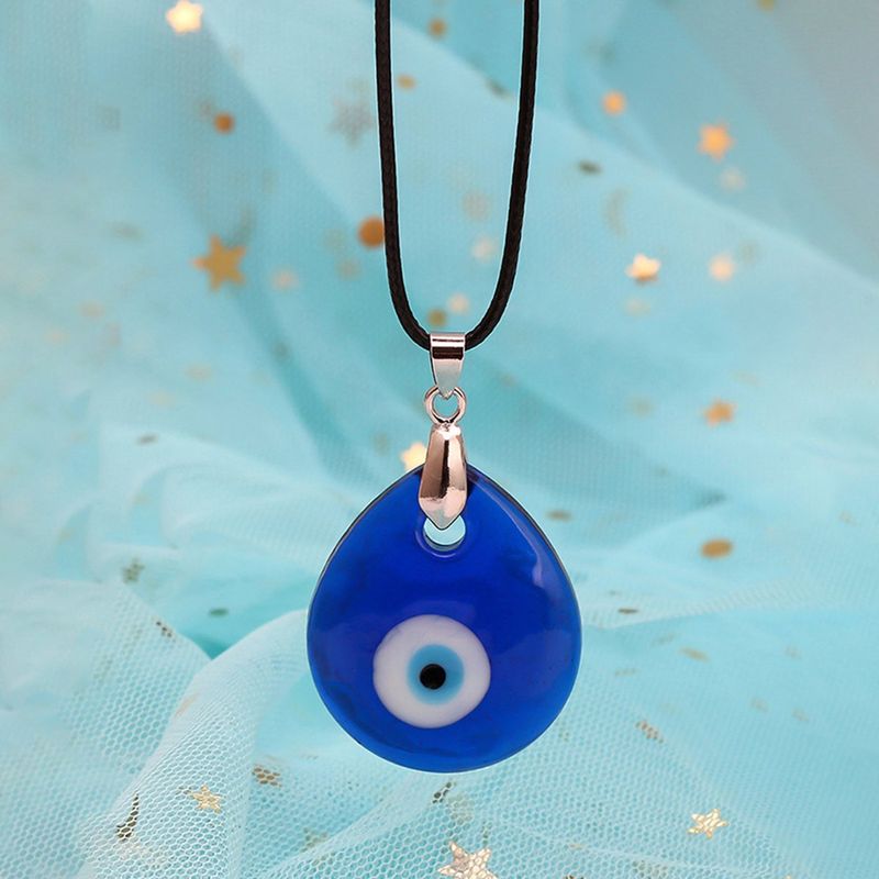 Buy Yellow Chimes Evil Eye Locket Charm Black Leather Rope Pendant ...