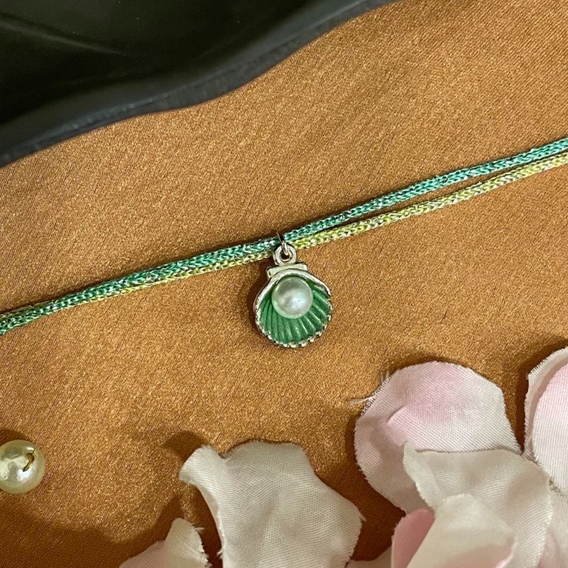 Buy Digital Dress Room Silver Plated Green Shell With Pearl Charm Rakhi ...