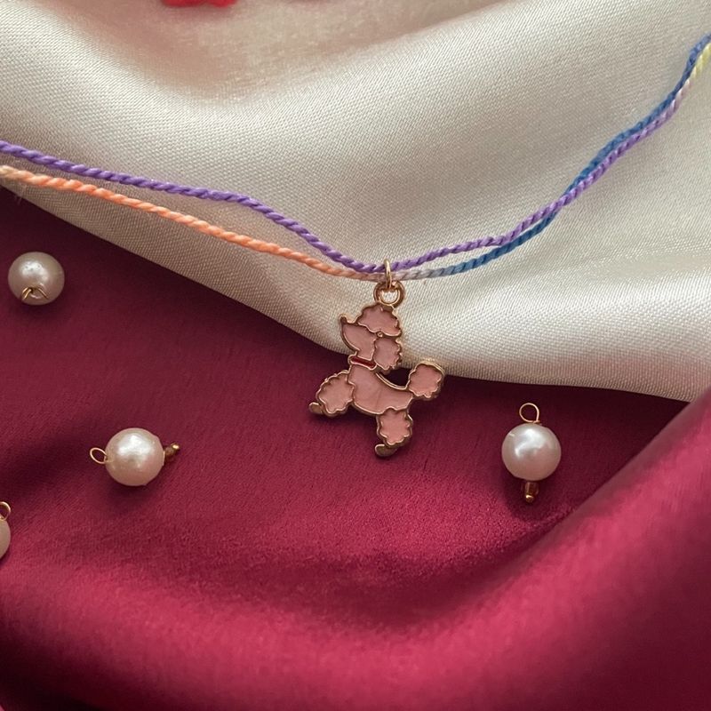 Buy Digital Dress Room Gold Plated Pink Enamel Pet Dog Charm Rakhi For ...