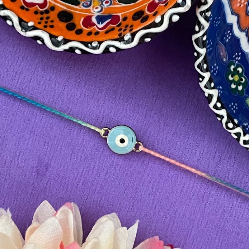 Buy Digital Dress Room Gold Plated Sky Blue Evil Eye Charm Rakhi For ...
