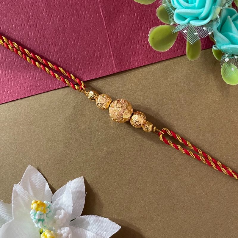 Buy Digital Dress Room Gold Plated Ball Design Pendant Rakhi For Raksha ...