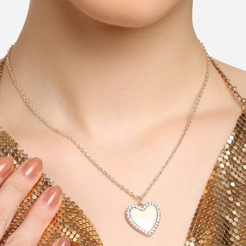 Buy Zaveri Pearls White Enamelled Austrian Diamonds Heart Shape Pendant ...